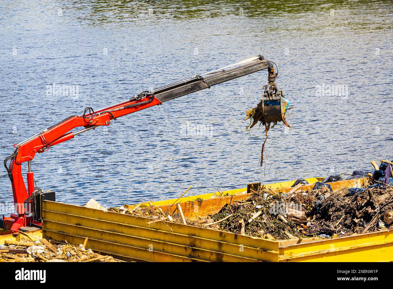 dredger cleans the bottom of the pond. excavator cleans the river ...