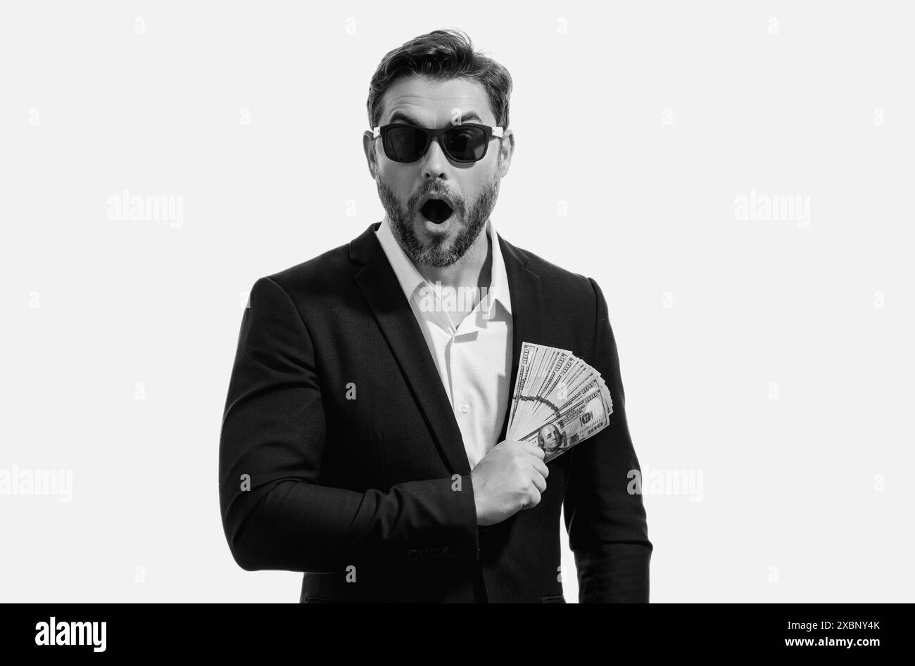 Good payment. Handsome business man holding money isolated over grey ...
