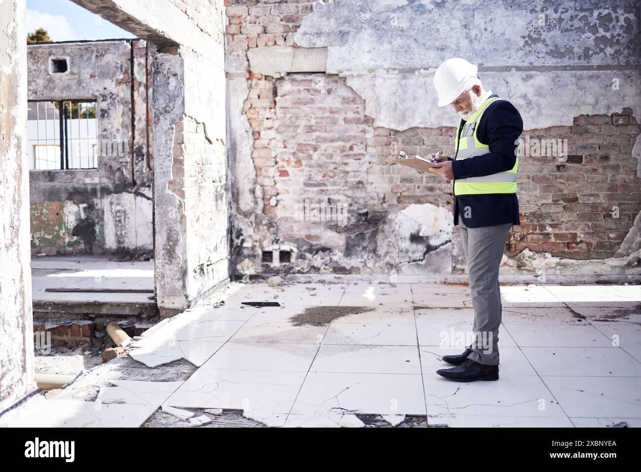 Building, disaster and engineer with clipboard and helmet for notes ...