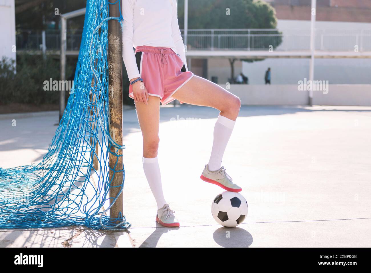 female football player stepping on a soccer ball Stock Photo - Alamy