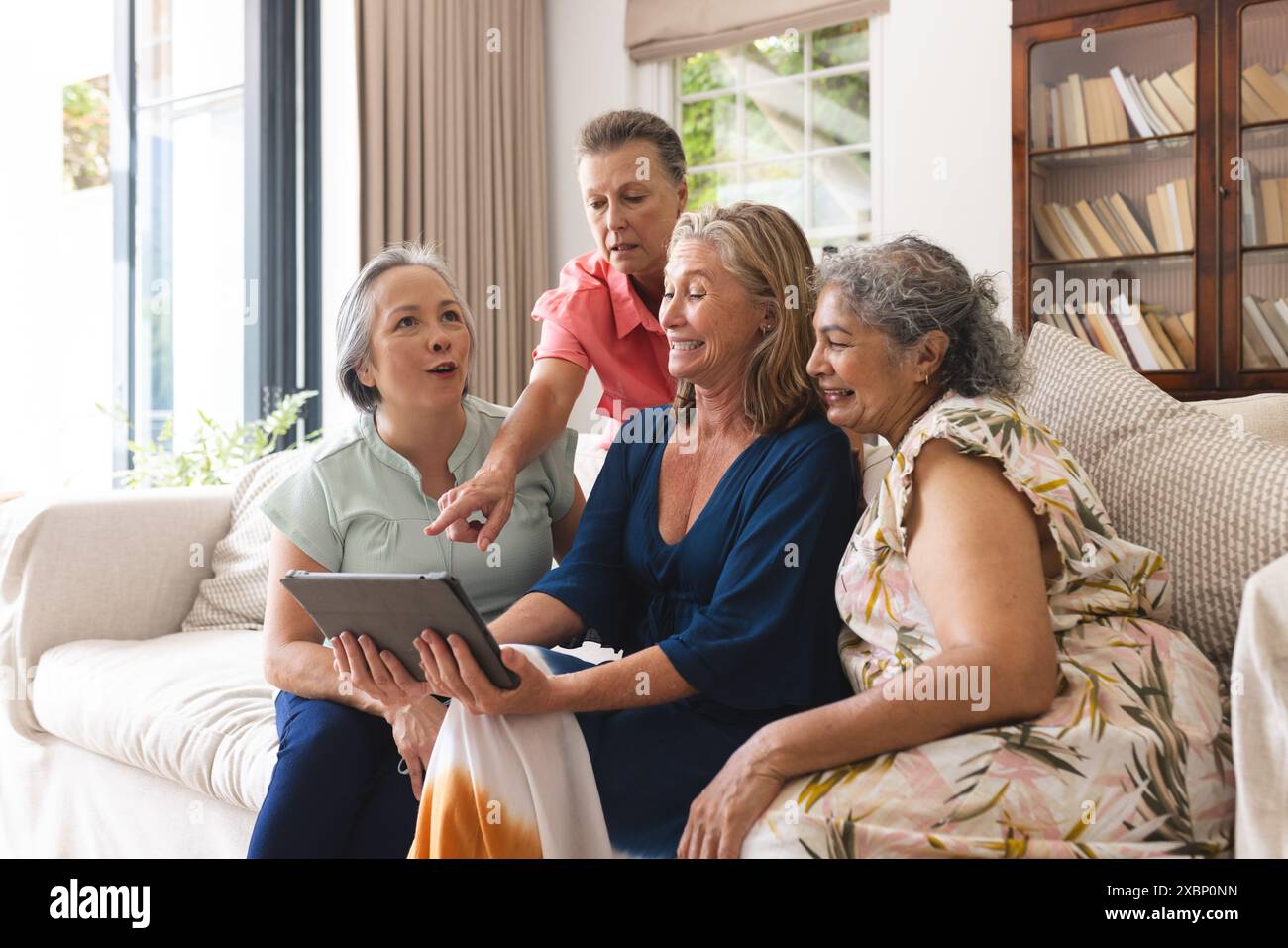 Group of women sitting on sofa hi-res stock photography and images - Alamy