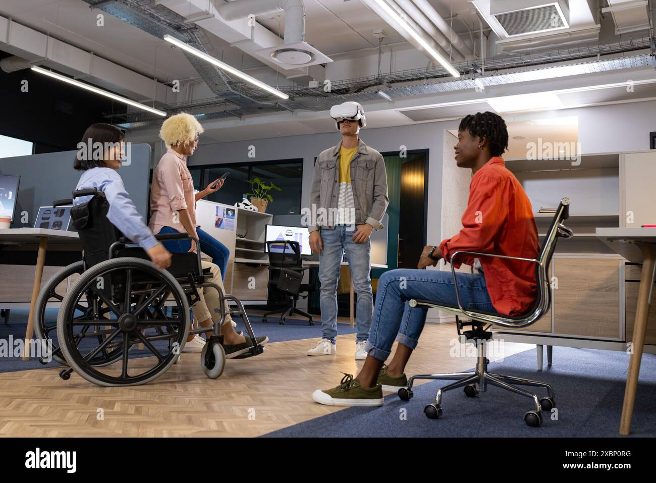 Business colleagues in office watching man using vr headset, asian ...