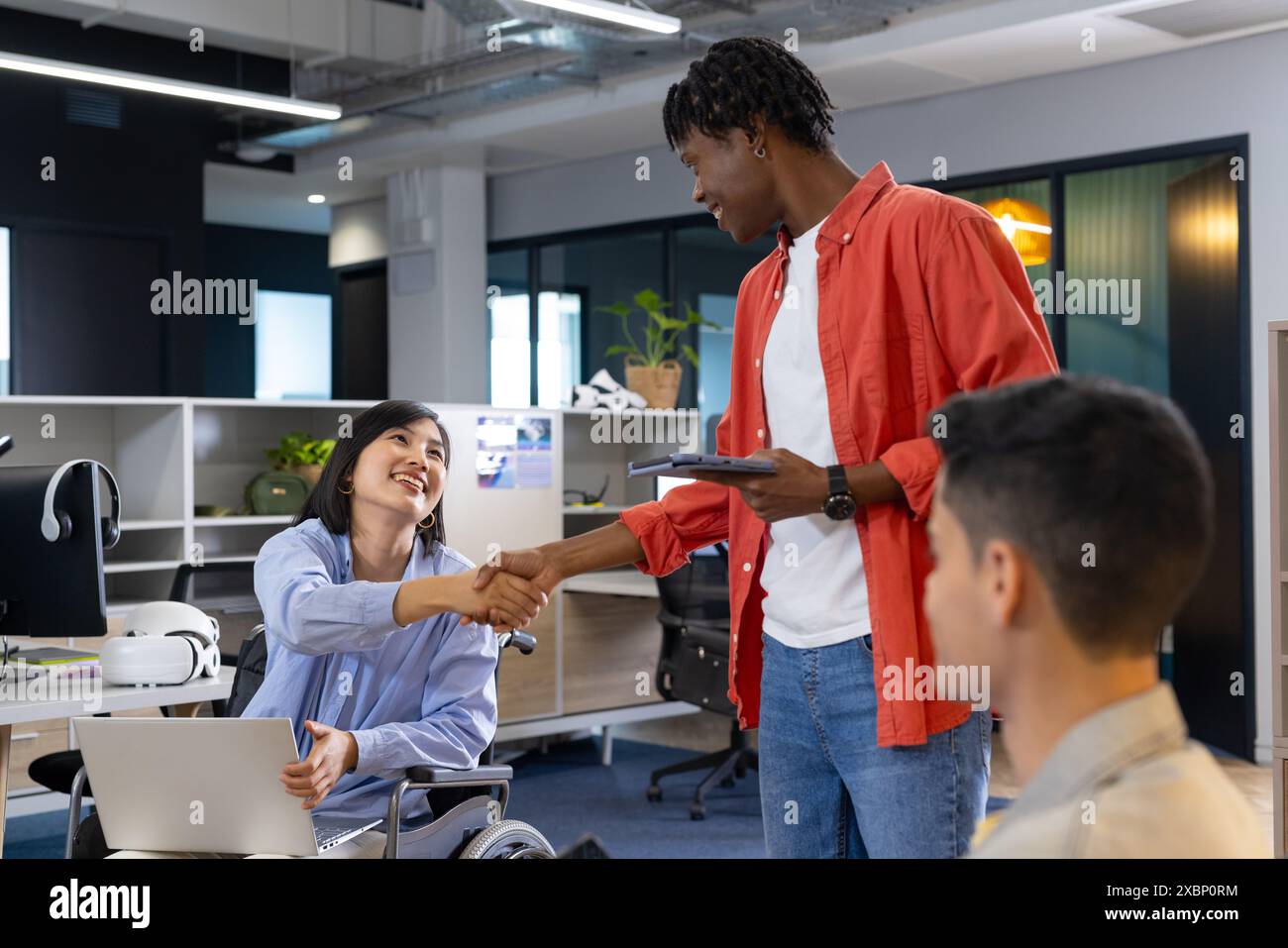 Colleagues collaborate in modern office, focusing on teamwork, business ...