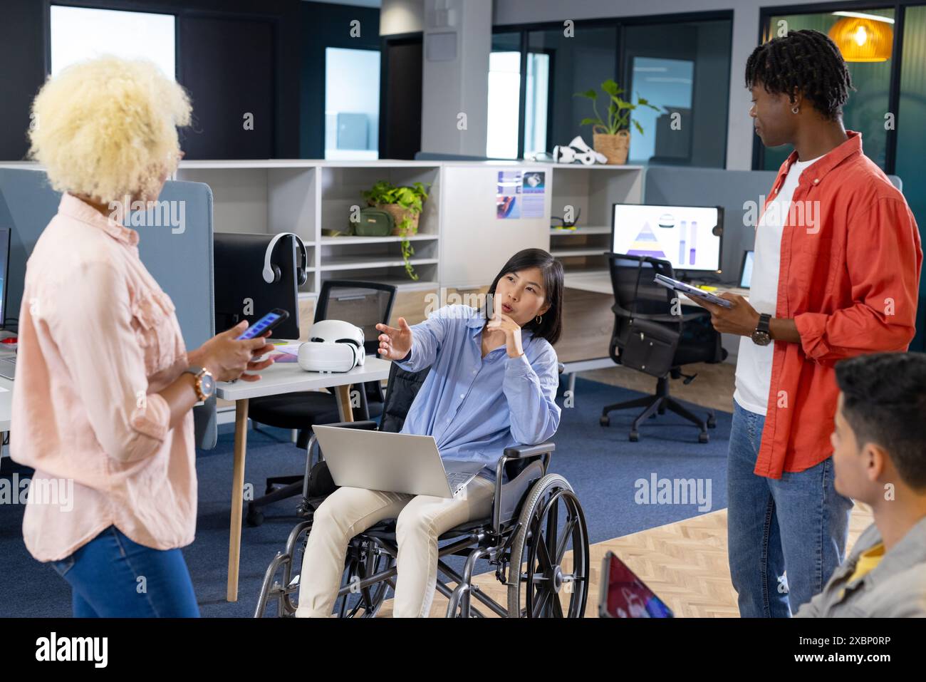Working in wheelchair diverse hi-res stock photography and images - Alamy