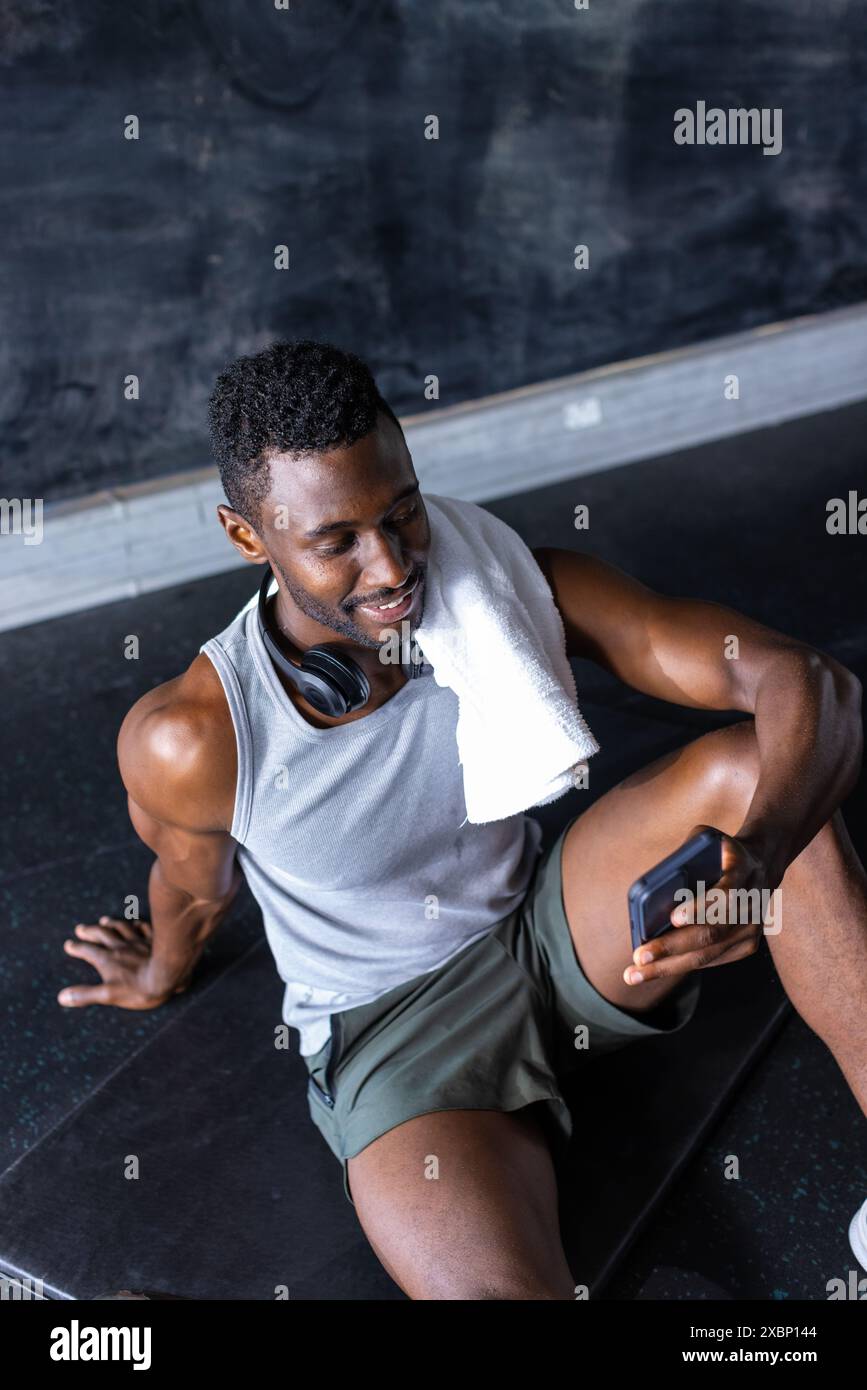 Exercising and working out, strong and fit African American man sitting ...