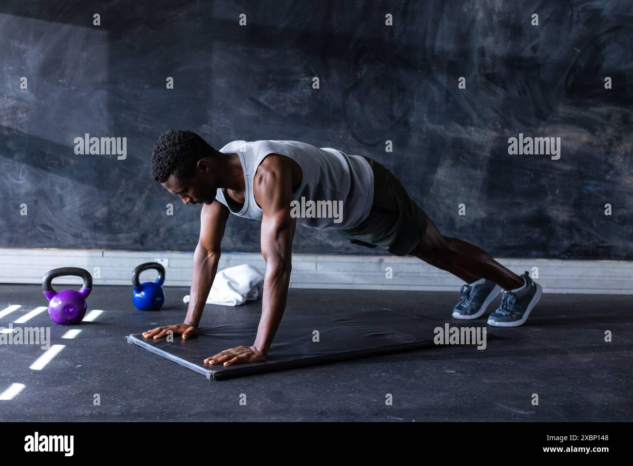 Exercising and working out, strong and fit African American athlete ...