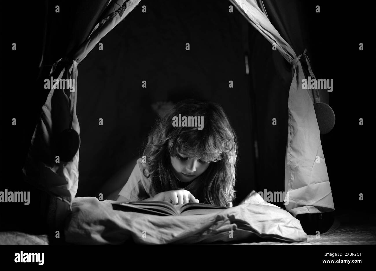 Kids reading books. Serious child reading books, looks serious and ...