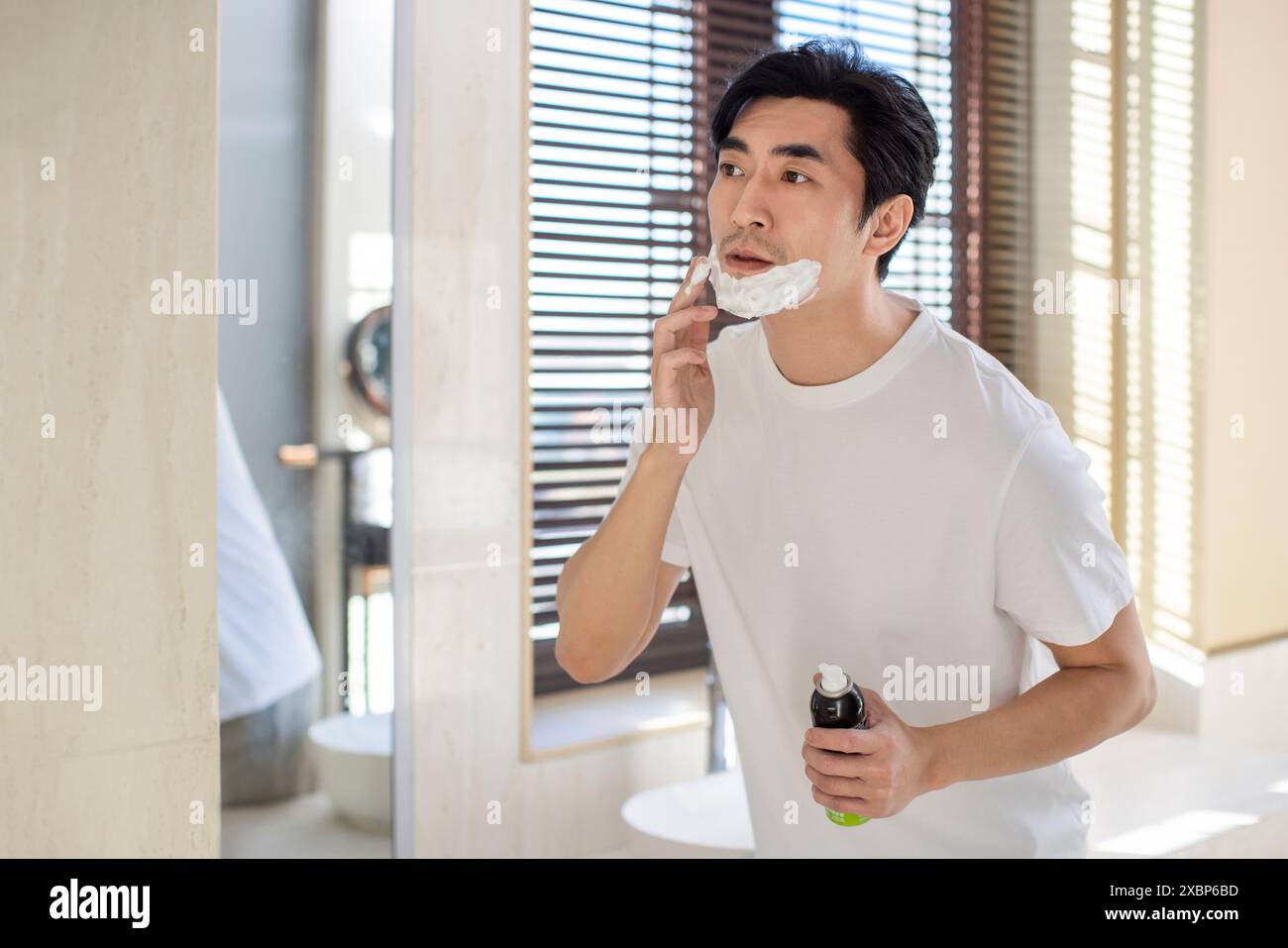 Mature Man In Bathroom Shaving Stock Photo - Alamy