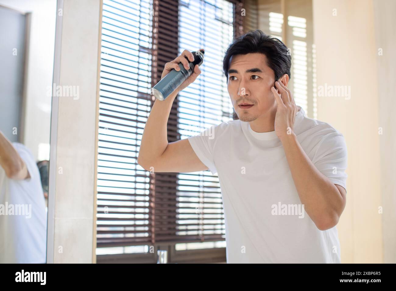 Mature Man Fixing His Hair Stock Photo - Alamy
