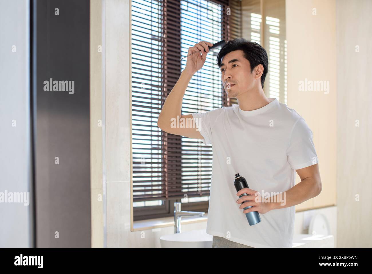 Mature Man Fixing His Hair Stock Photo - Alamy