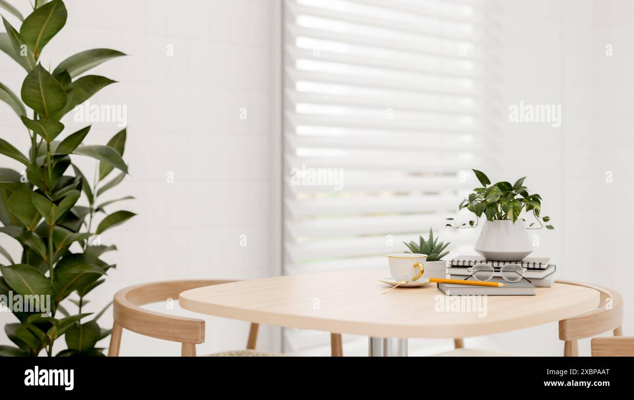 A close-up image of a wooden table by the window in a white room ...