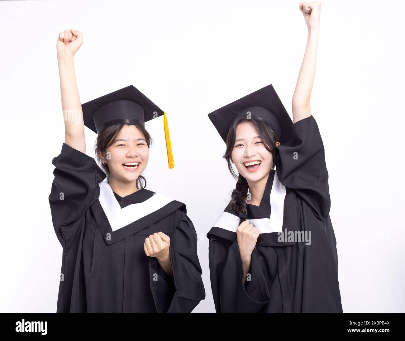 Happy and success girl friend graduates in cap and gown Stock Photo - Alamy