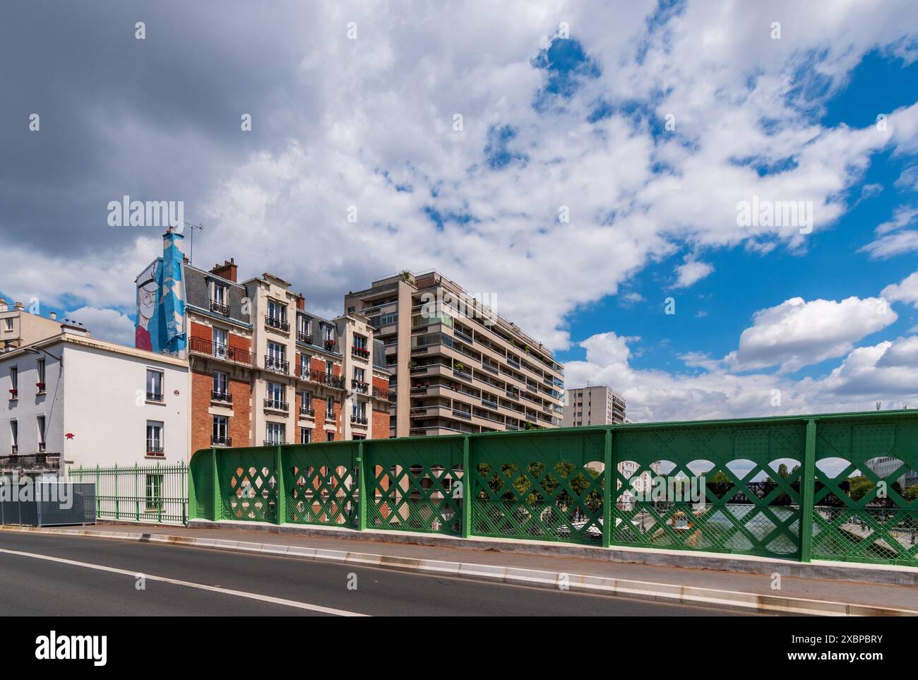 Paris, France - 06 13 2024 : the rue de l'Ourcq with its bridge over ...