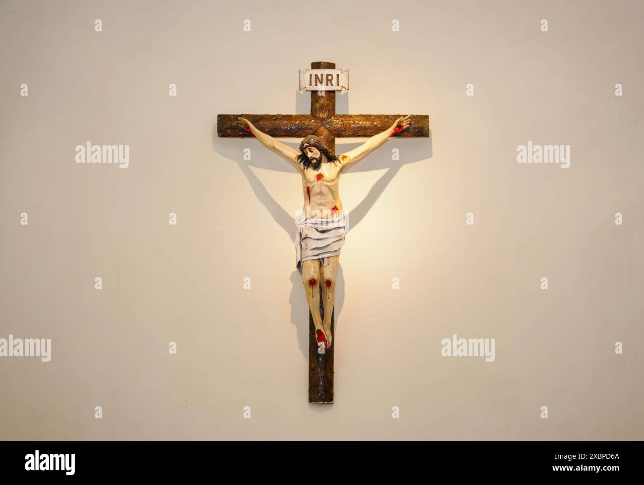 Crucifix representing jesus christ being crucified on wooden cross with inri sign above his head ...