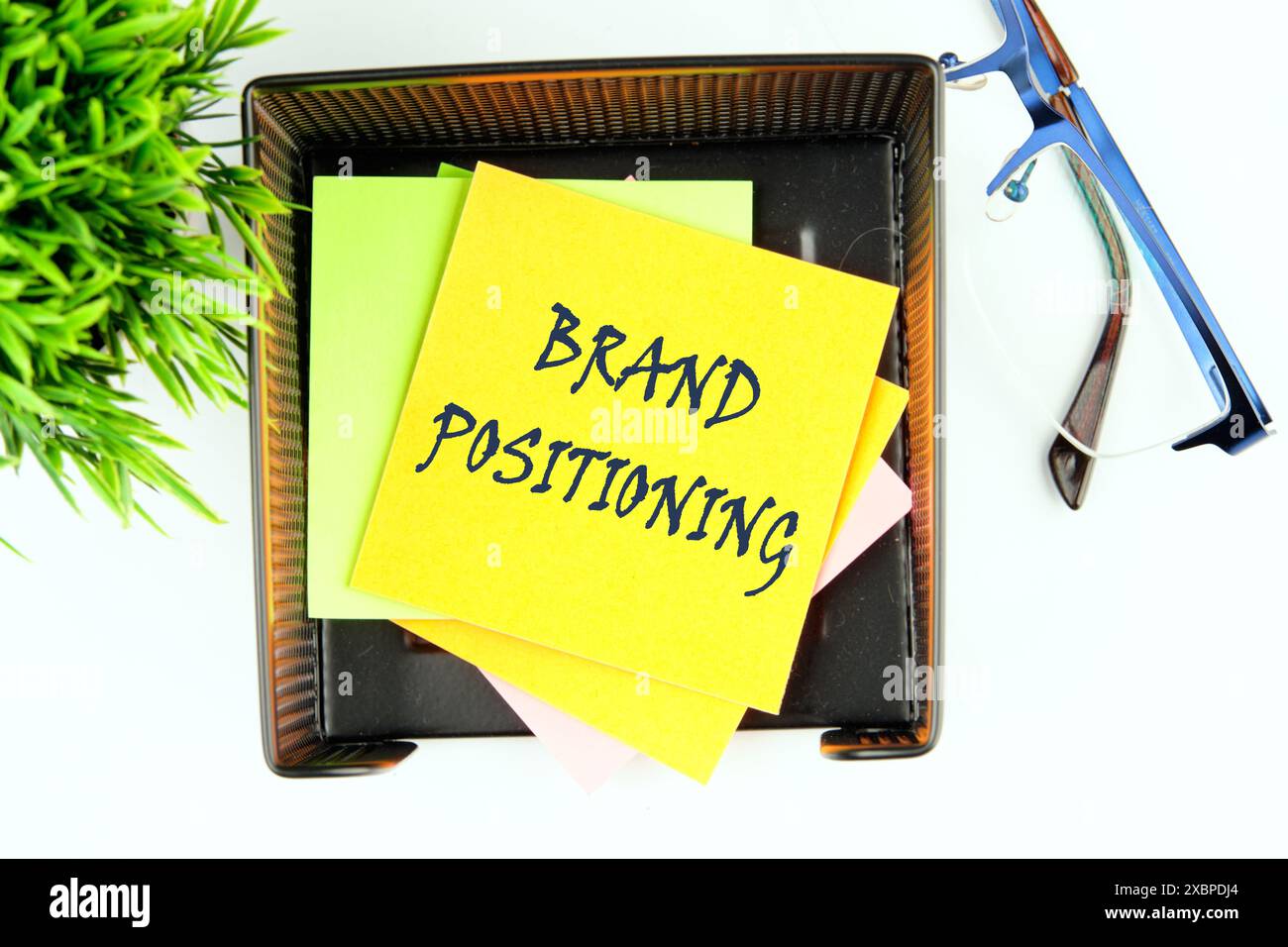 Business branding concept. BRAND POSITIONING text on a yellow sticker ...