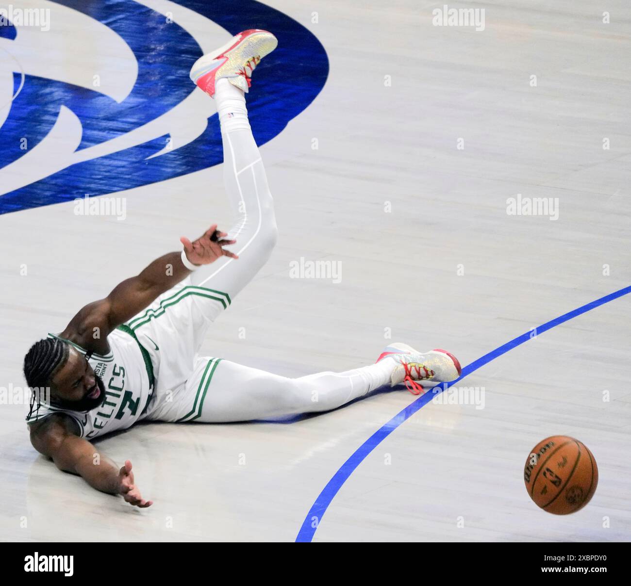Dallas, USA. 12th June, 2024. Jaylen Brown of Boston Celtics falls down ...