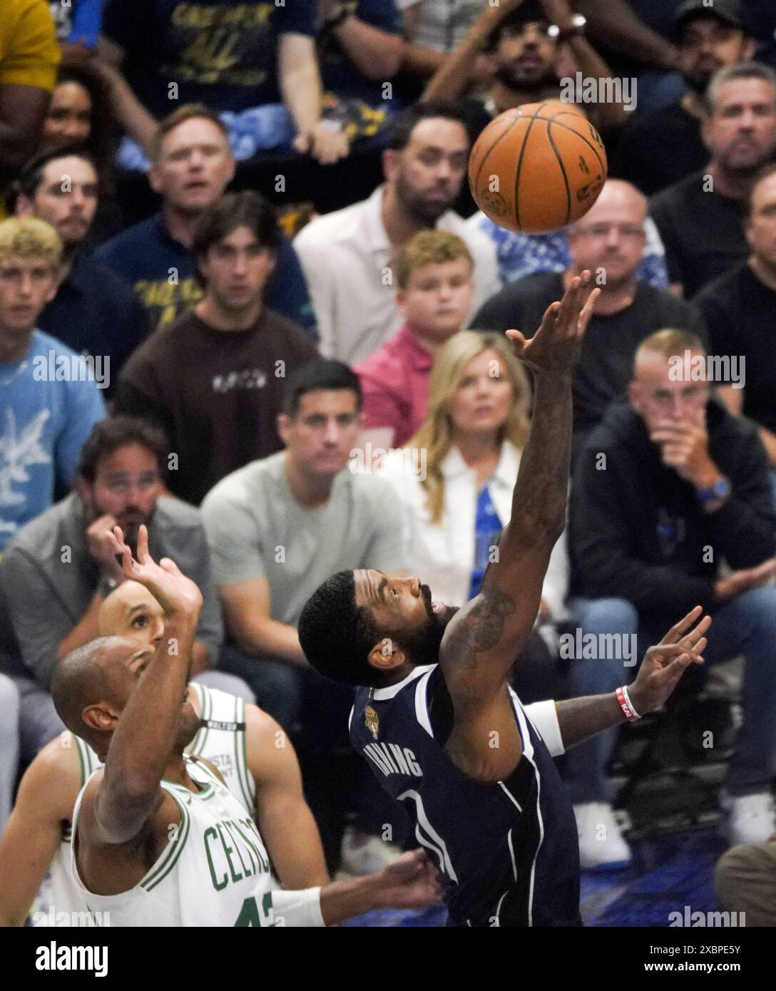 Dallas, USA. 12th June, 2024. Kyrie Irving (R) of Dallas Mavericks goes ...