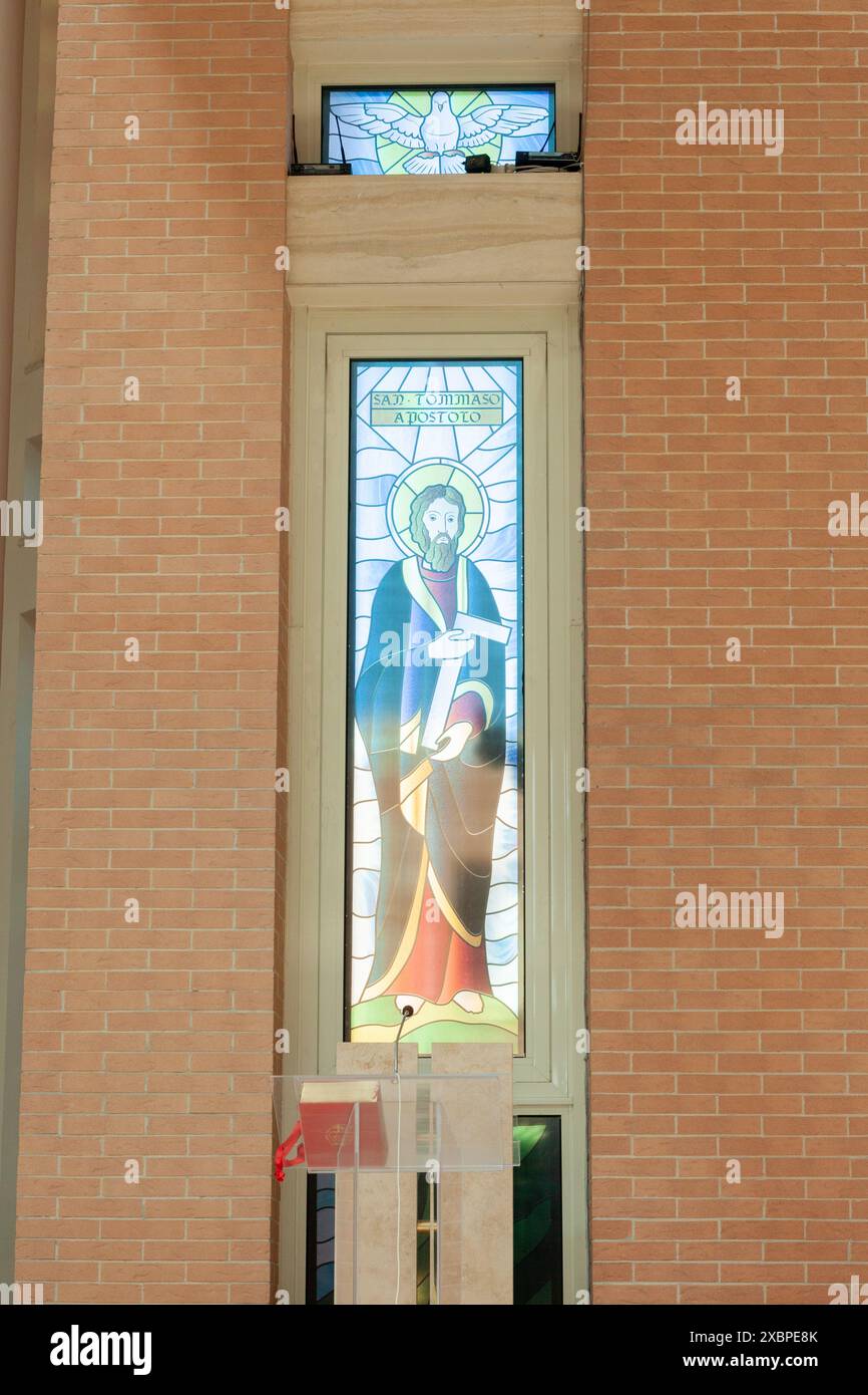 Stained glass window depicting saint jude thaddeus holding a crucifix ...