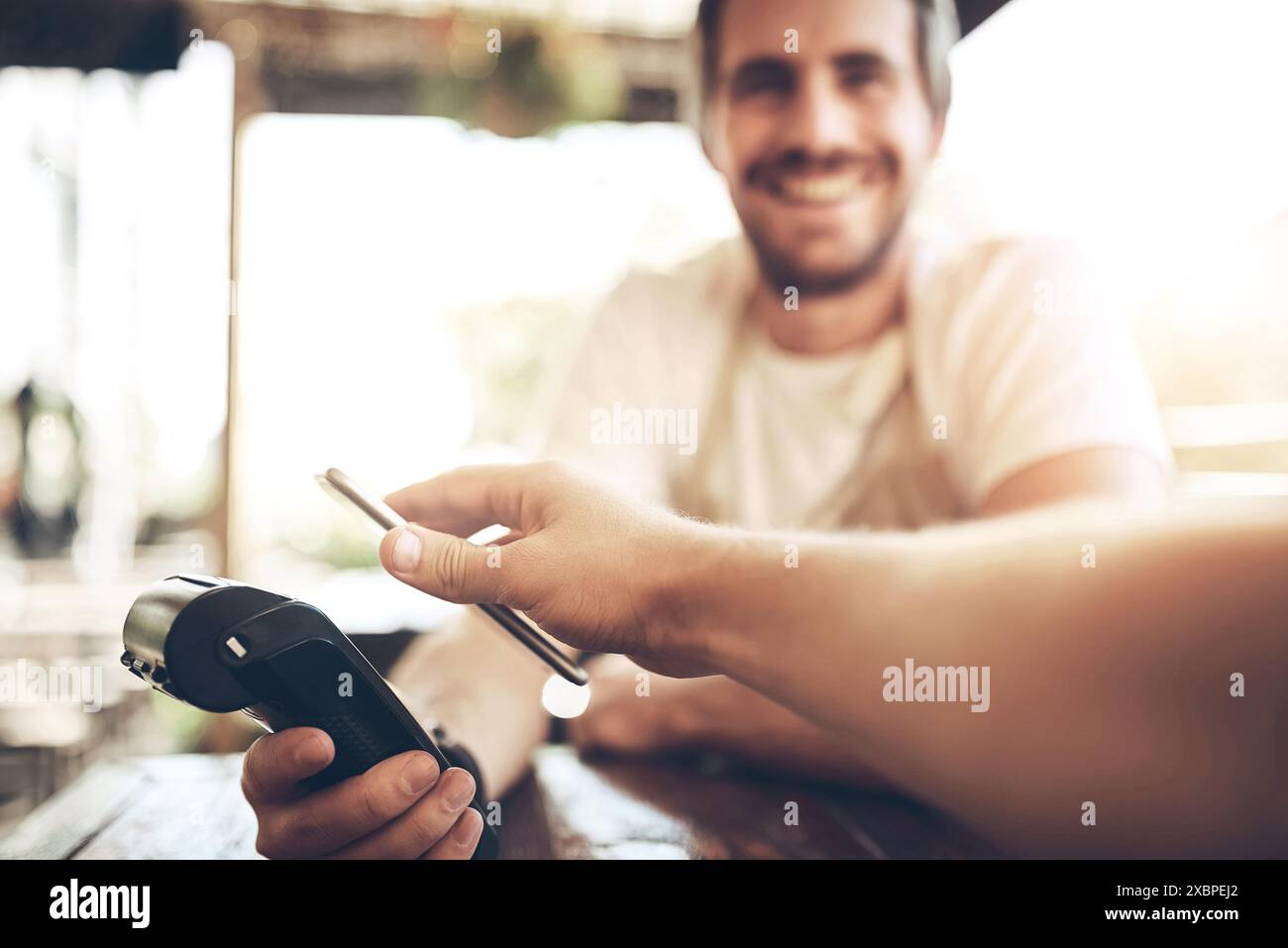 Barista, smartphone and pos terminal in restaurant for payment by ...