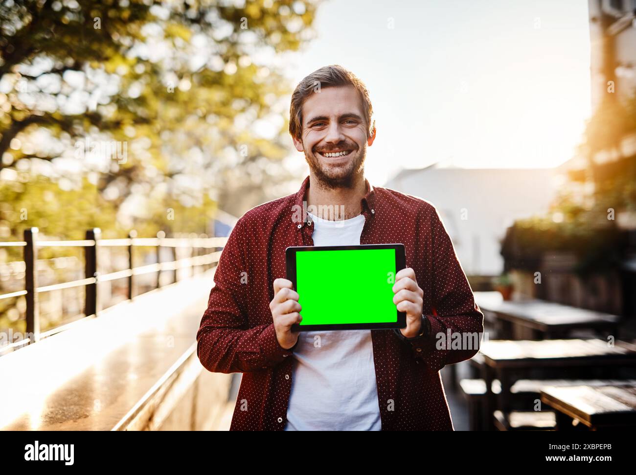 Portrait, man and tablet with green screen for internet in outdoor cafe ...