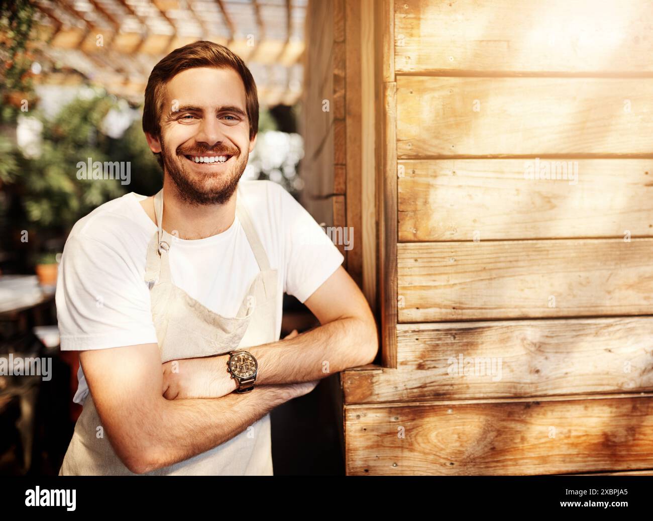 Happy, portrait and man waiter outdoor with crossed arms for positive ...