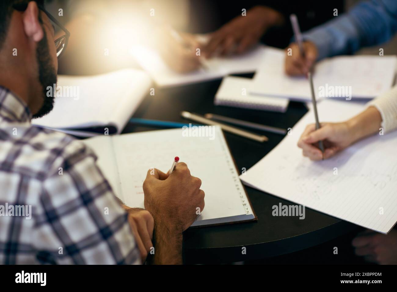 Writing, notes and group of people in library together for university ...