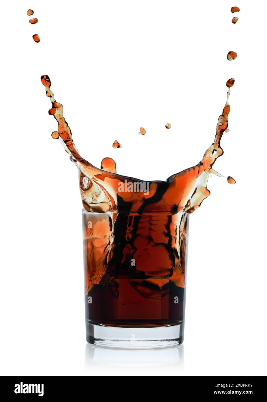 Splash in glass with cola beverage, isolated on a white background ...