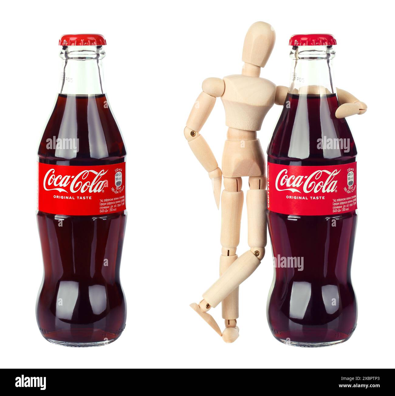 Set of Coca-Cola soft drink bottle and wooden manikin embrace it ...