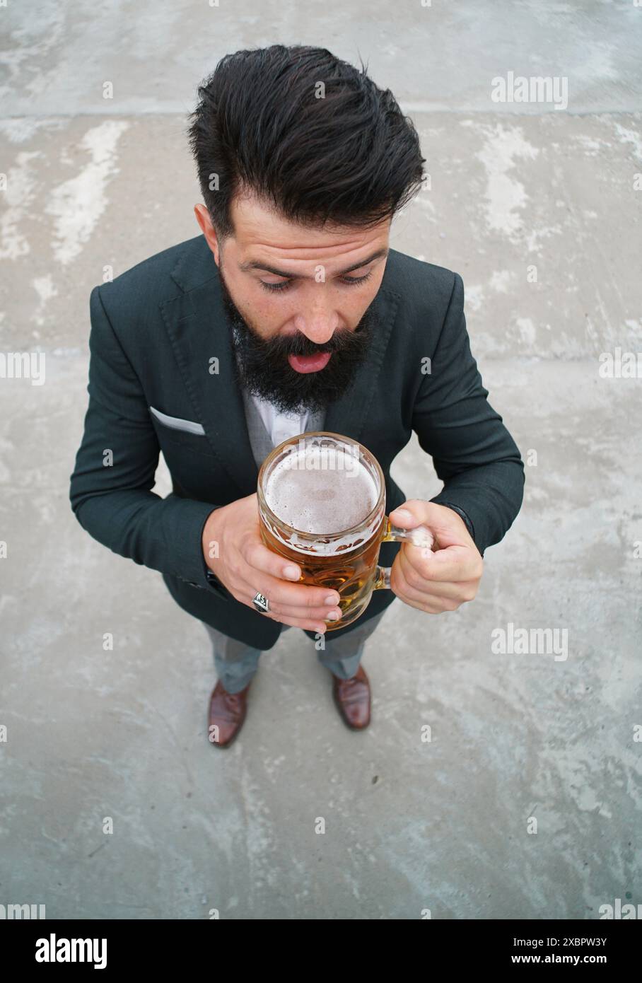 Full length, wide angle. Funny excited man in classical suit holding ...