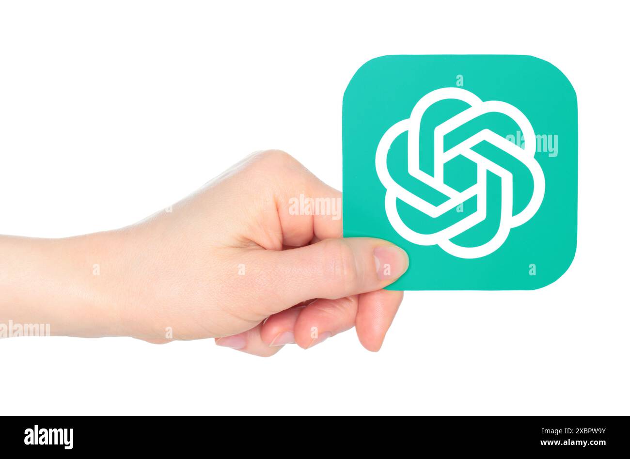 Hand holds paper OpenAI ChatGPT mobile app icon, on a transparent ...