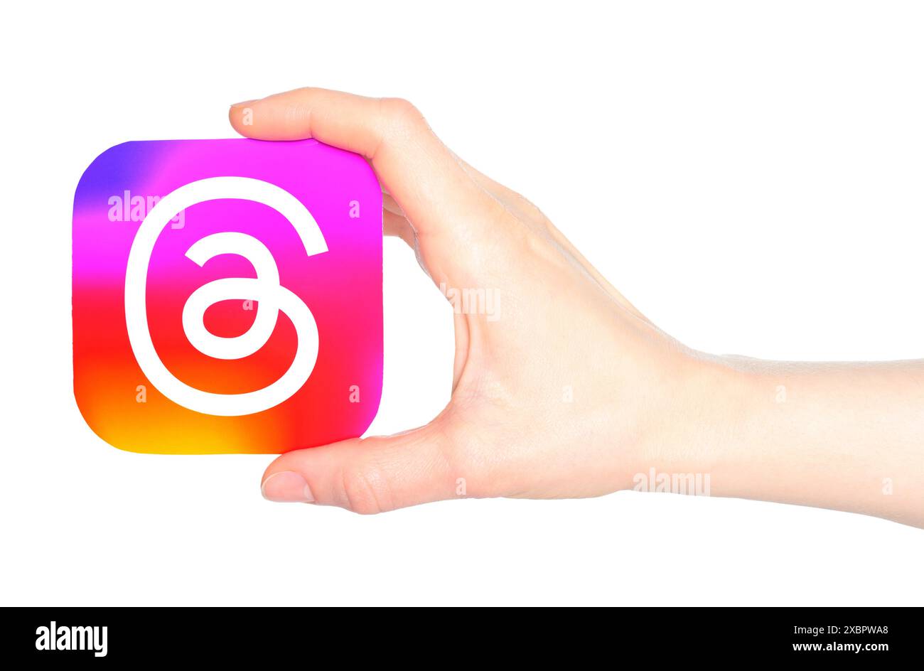 Hand holds paper Threads mobile app icon, on a transparent background ...