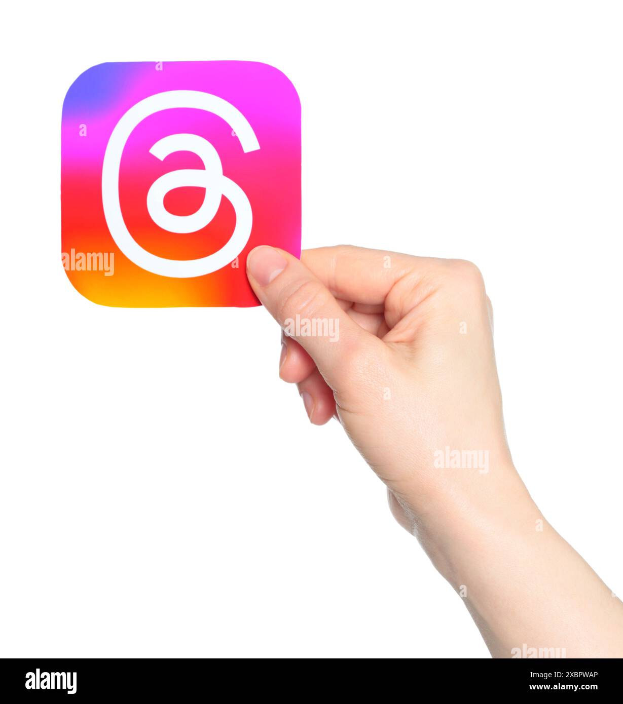 Hand holds paper Threads mobile app icon, on a transparent background ...