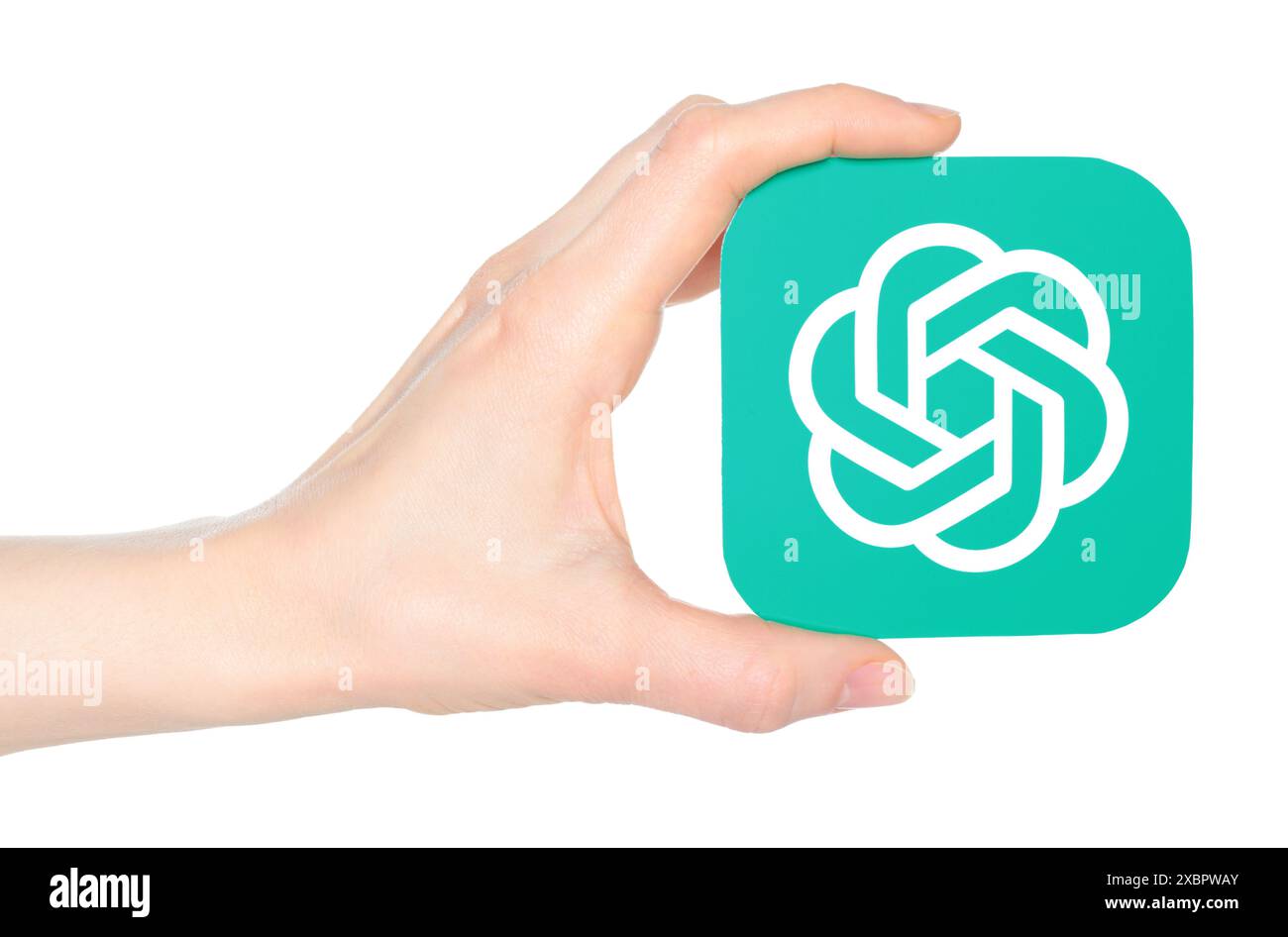 Hand holds paper OpenAI ChatGPT mobile app icon, on a transparent ...