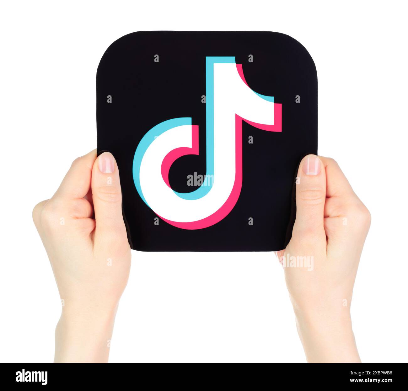 Hands holding paper TikTok mobile app icon, on a transparent background ...