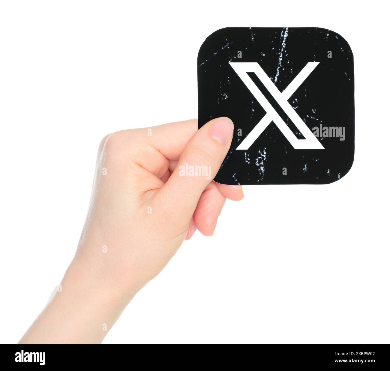 Hand holds paper X - Twitter mobile app icon, on a transparent ...