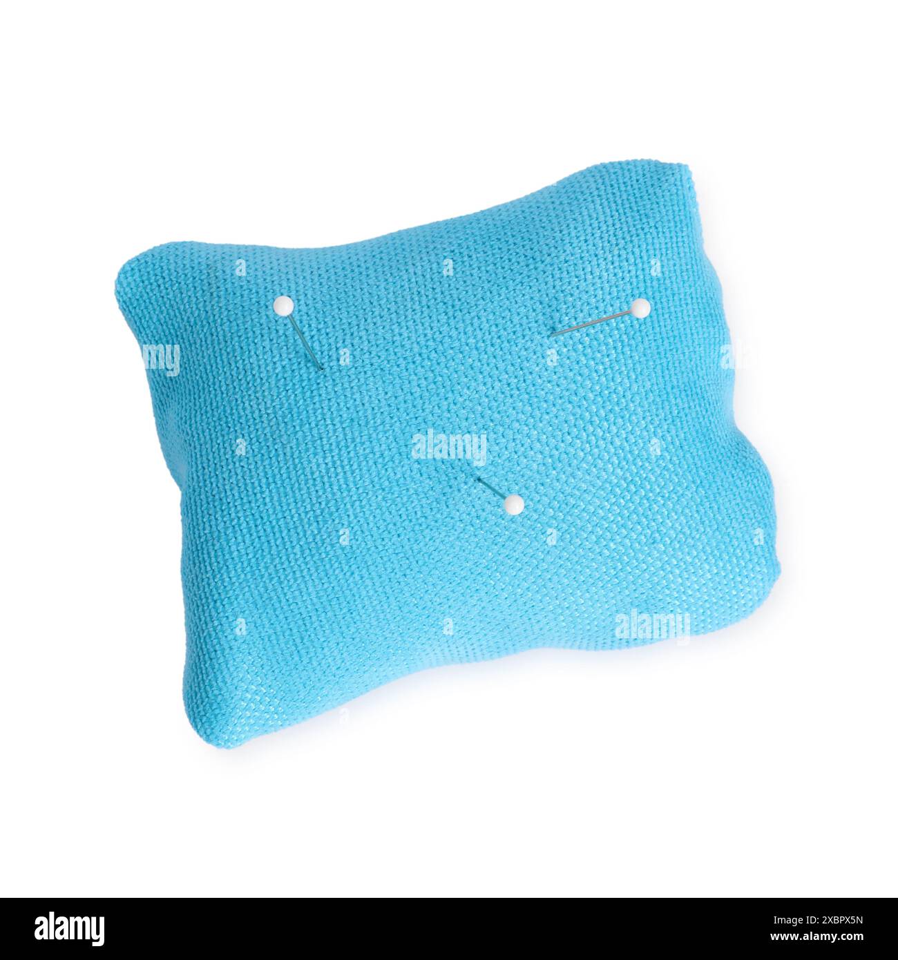 Light blue pincushion with sewing pins isolated on white, top view ...