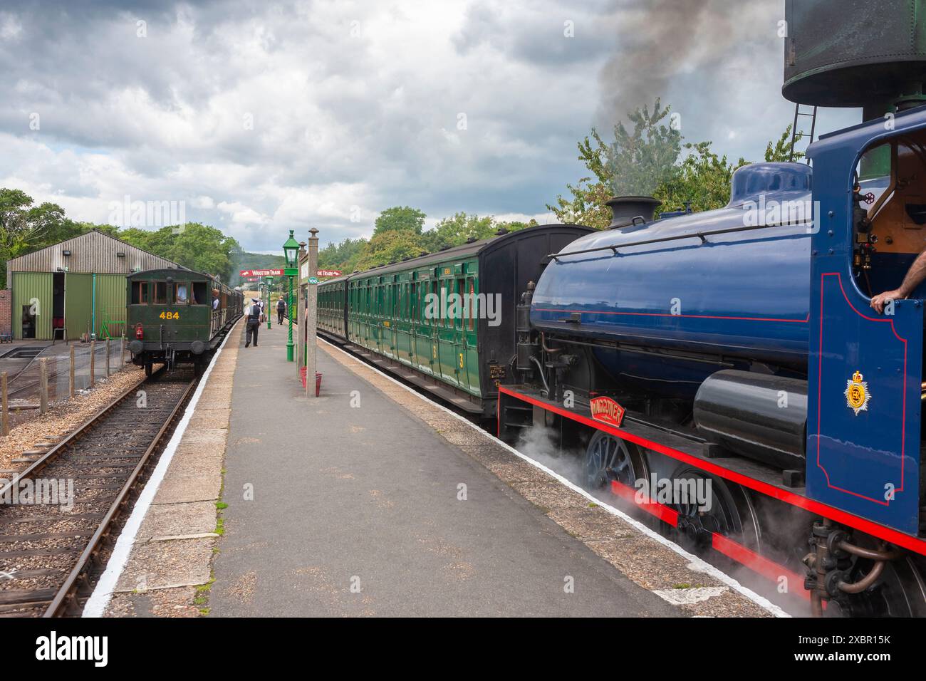 Two trains on the Up and Down platforms both waiting to leave ...