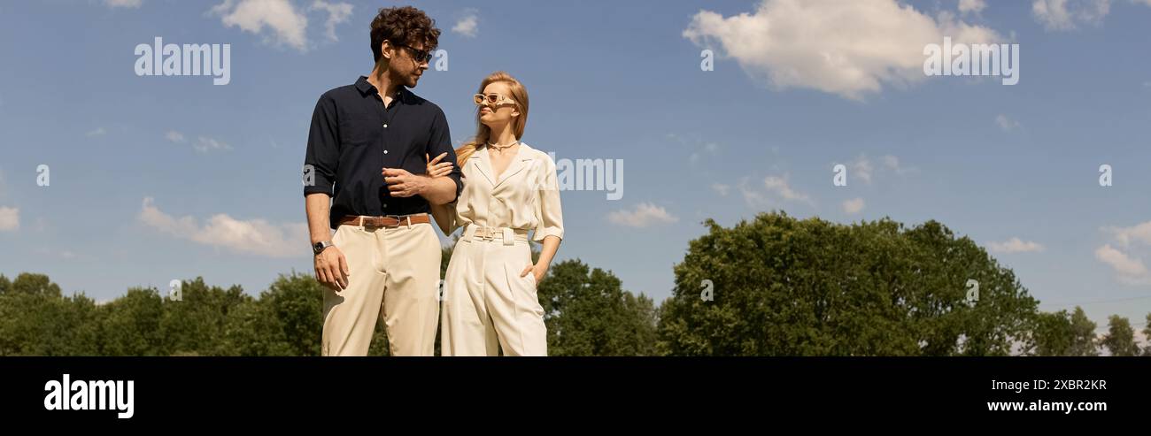 A beautiful young couple in elegant attire standing gracefully in a ...