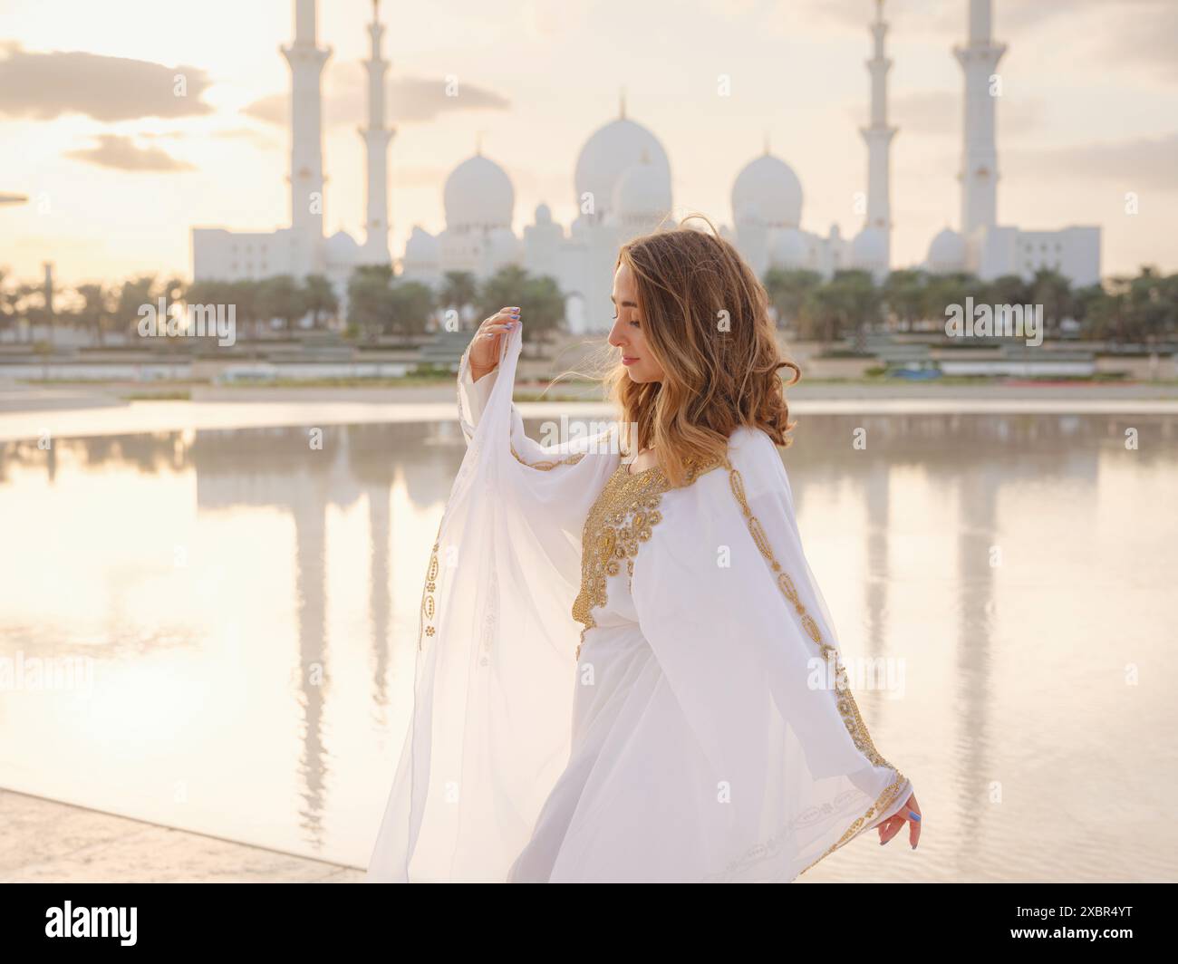 Travel to the United Arab Emirates, Abu Dhabi. Woman in white Arabic ...