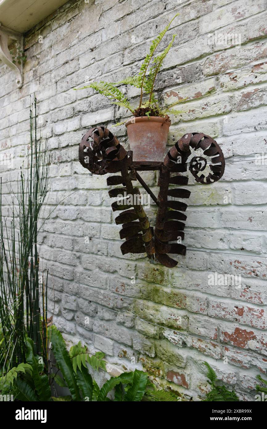Metal fern plant pot holder Stock Photo - Alamy
