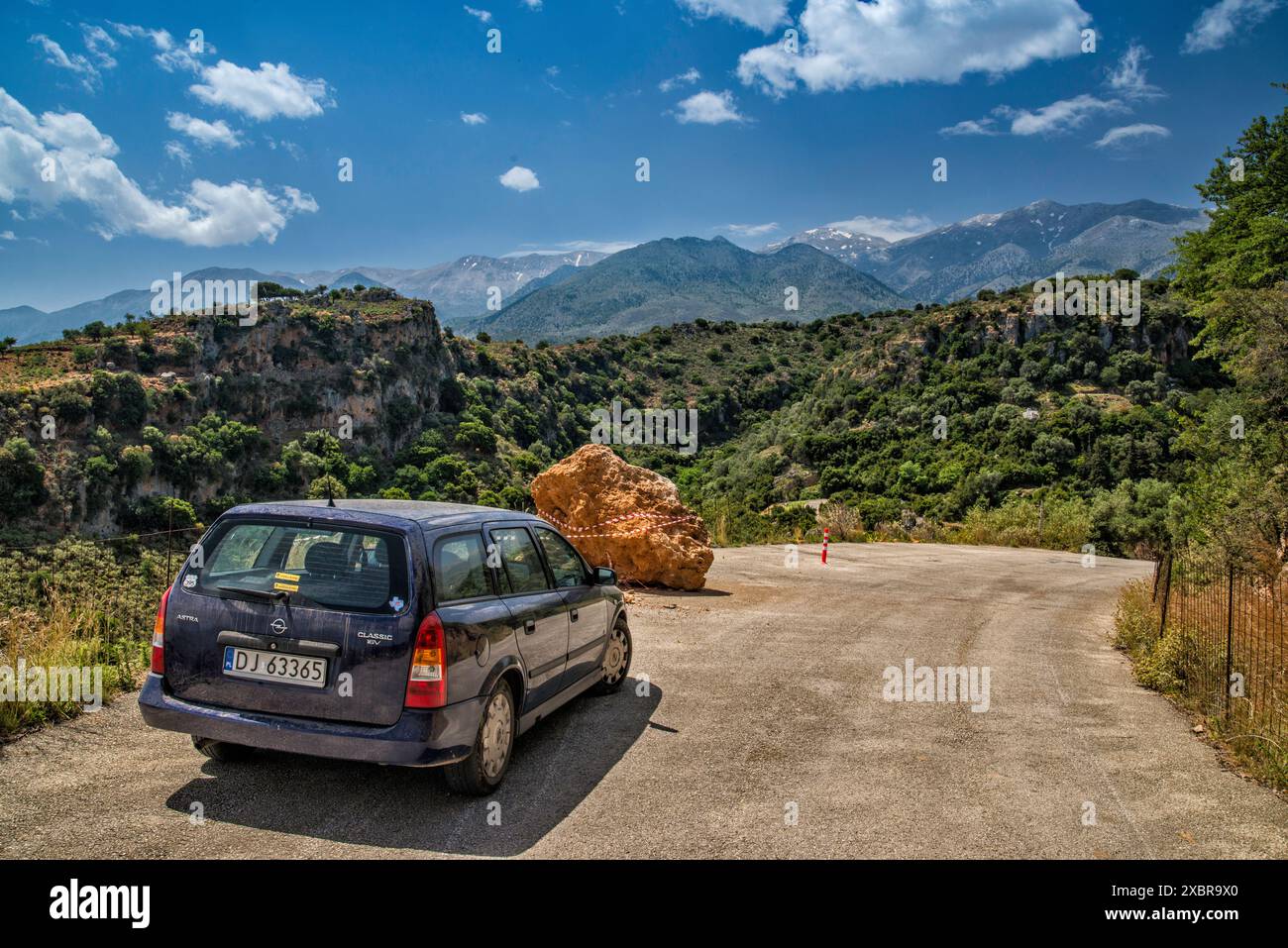Huge boulder which came down the mountain, on road near village of ...
