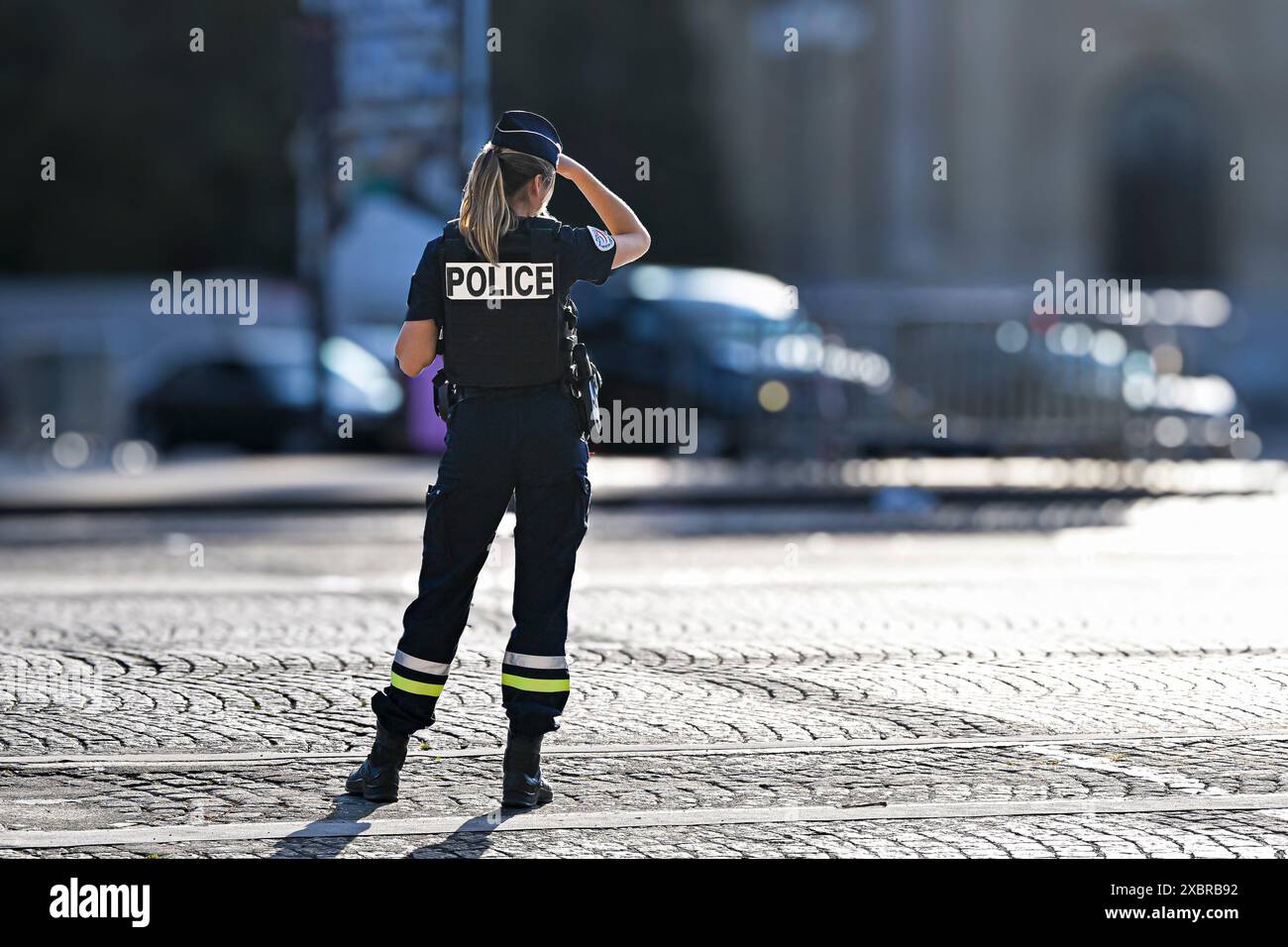 Paris, France. 12th June, 2024. A female police officer (woman) with ...