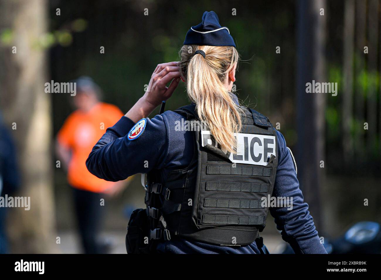 Paris, France. 12th June, 2024. A female police officer (woman) with ...