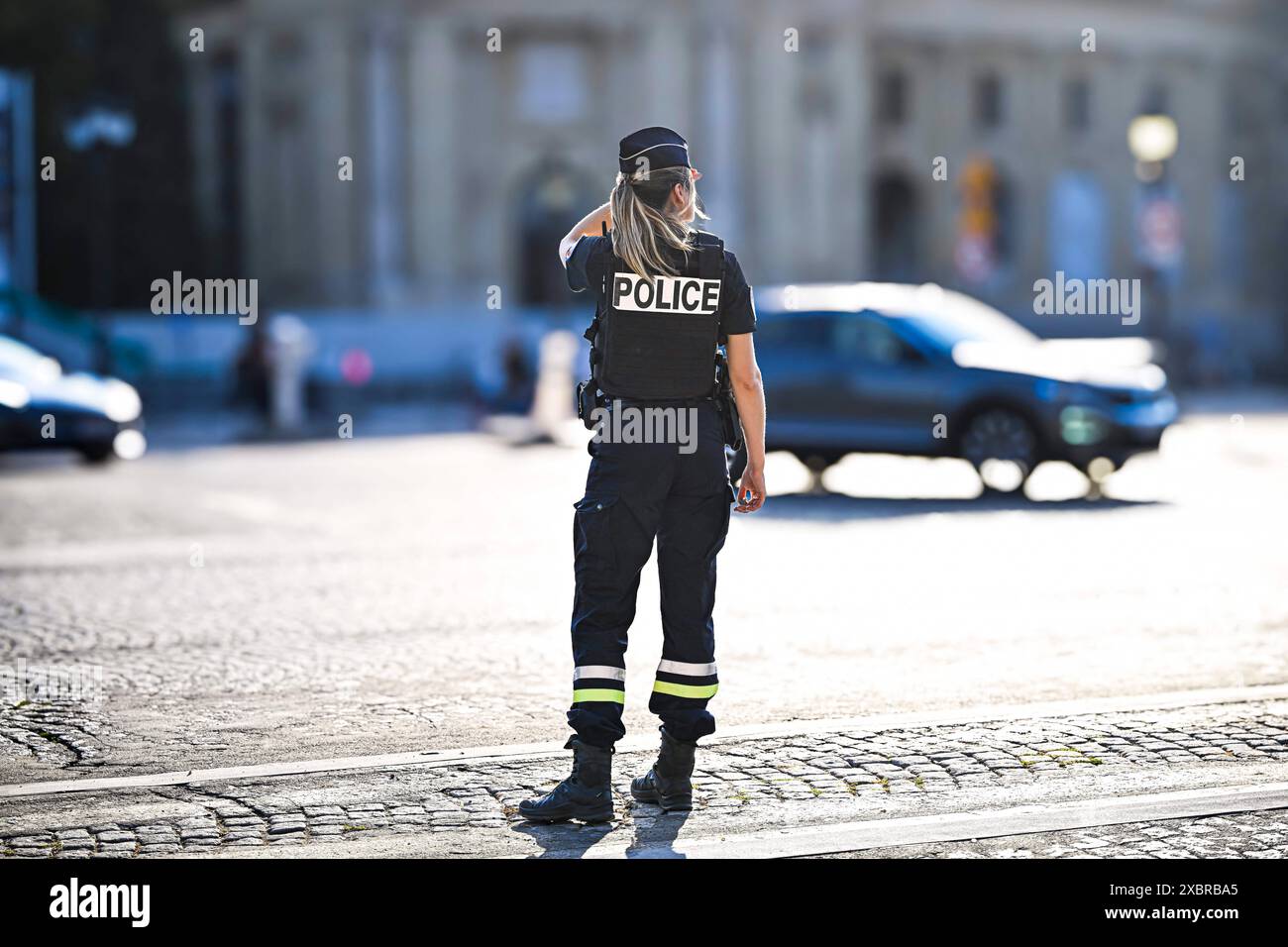Paris, France. 12th June, 2024. A female police officer (woman) with ...