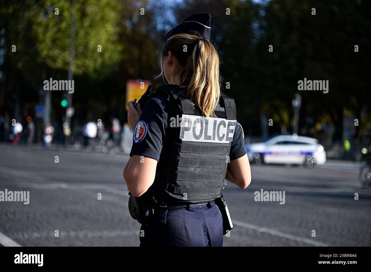 Paris, France. 12th June, 2024. A female police officer (woman) with ...