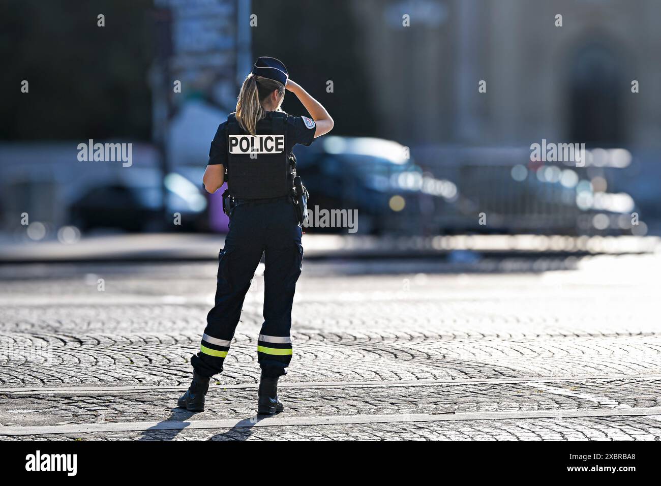 Paris, France. 12th June, 2024. A female police officer (woman) with ...