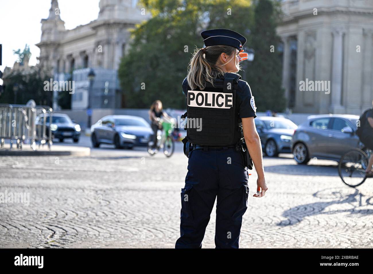 Paris, France. 12th June, 2024. A female police officer (woman) with ...