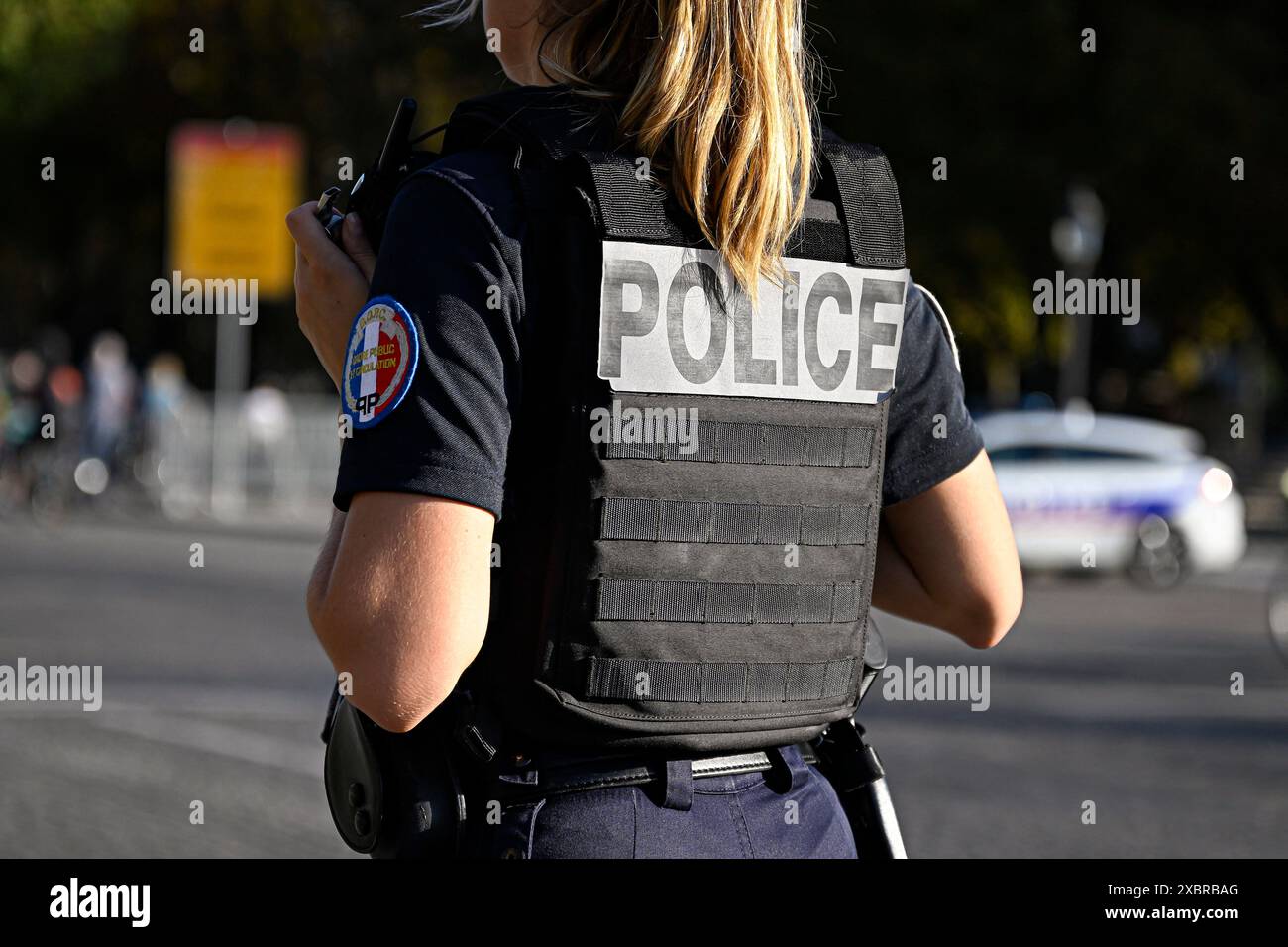 Paris, France. 12th June, 2024. A female police officer (woman) with ...