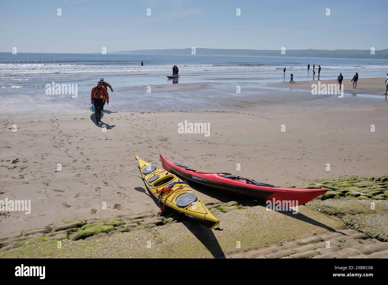 Kayakers at the northern beach off the Cobble Landing at Filey, North ...