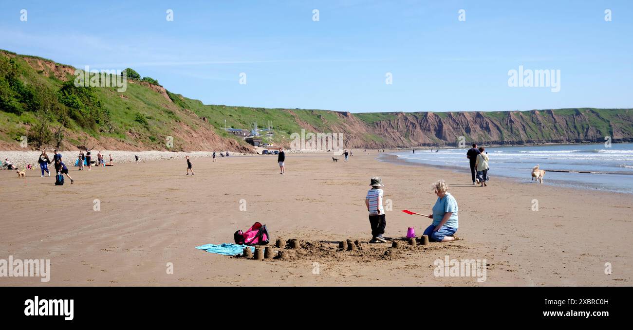 Grandmother and Grandchild enjoying the beach off the Cobble Landing at ...